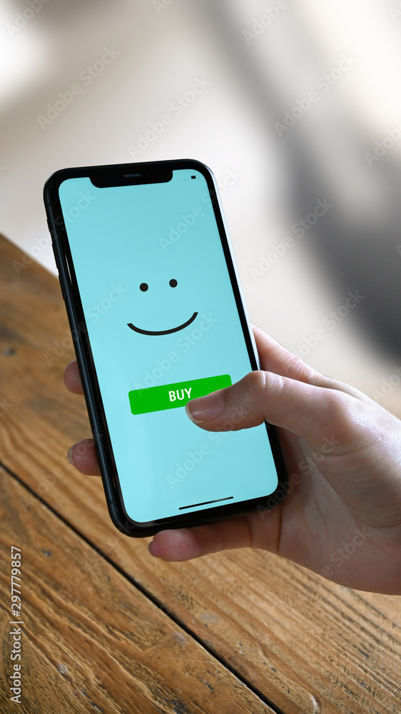 Make a smiley for handling and buy online. Woman with smartphone ...