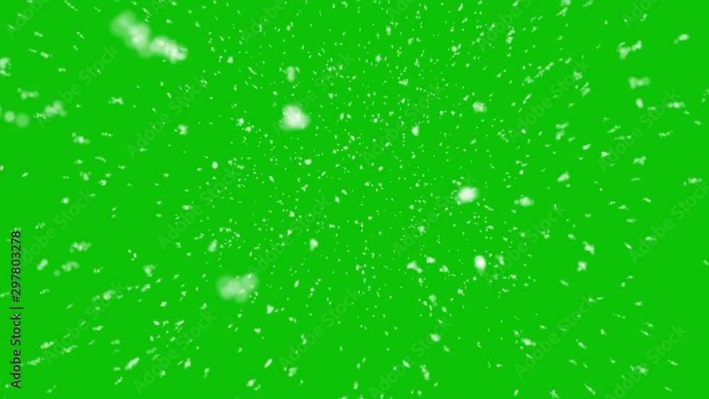 Isolated realistic snow falling on a camera. Green screen background ...