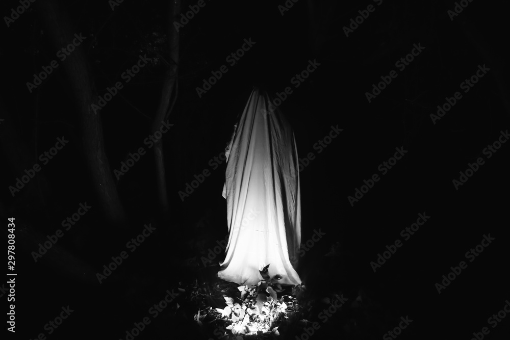 Ghost at night outdoors in pink lights. Halloween costume idea. Horror ...