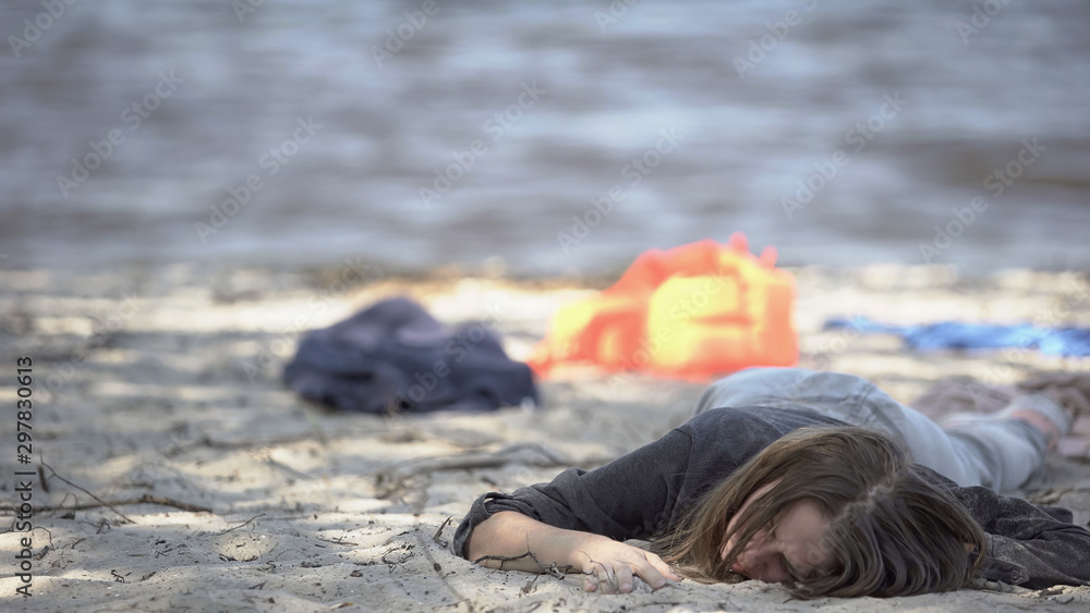 Unconscious woman lying on seashore after shipwreck, survival tips ...
