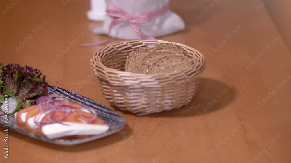 4K Camera pan of a food plate with sliced cheese, tomatos, onions and ...