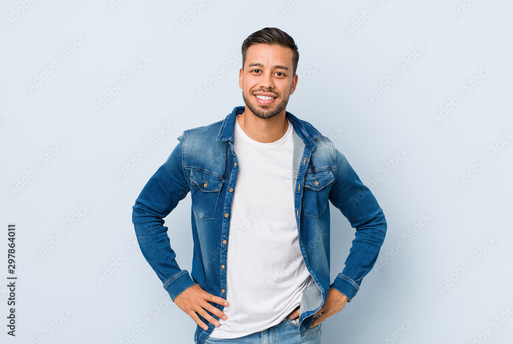 Young handsome filipino man confident keeping hands on hips. Stock ...