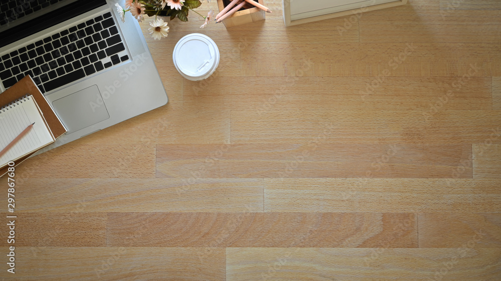 Office desk wood table top view laptop, coffee, notebook paper and ...