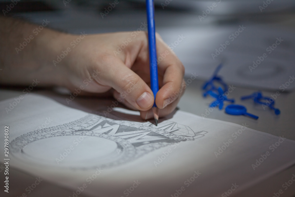 jeweller hand with pencil drawing on paper sketch of jewellery Stock ...