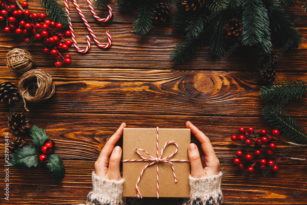 Christmas gift. Congratulations.Top wiew of woman holding traditional ...