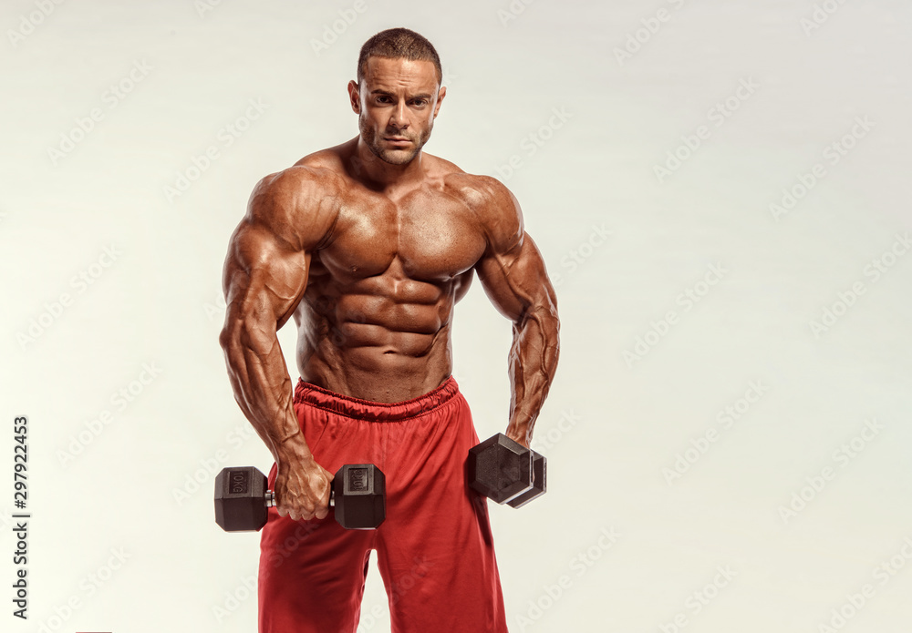 Bodybuilder Exercise With Dumbbells. Studio Shot. Copy space Stock ...