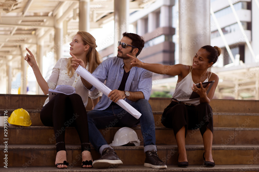 Civil engineering students sitting on the stairway skywalker for ...