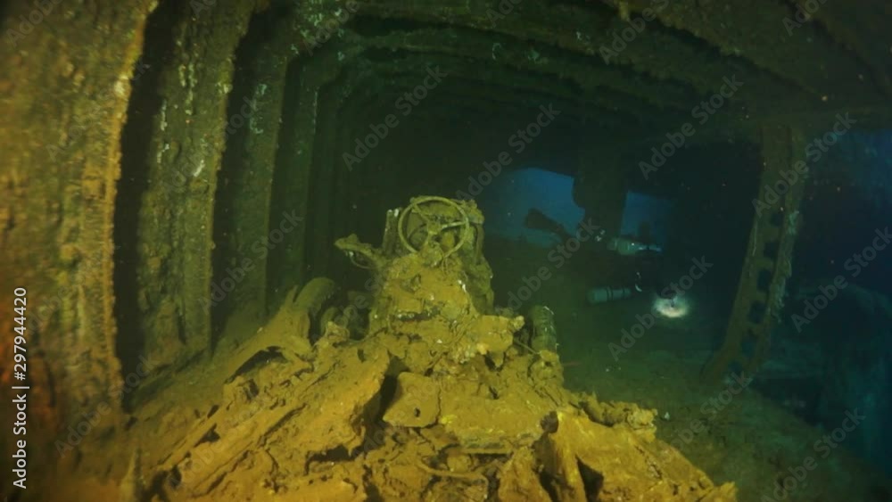 Diver on shipwreck underwater on Chuuk Islands. Sunken ship in historic ...