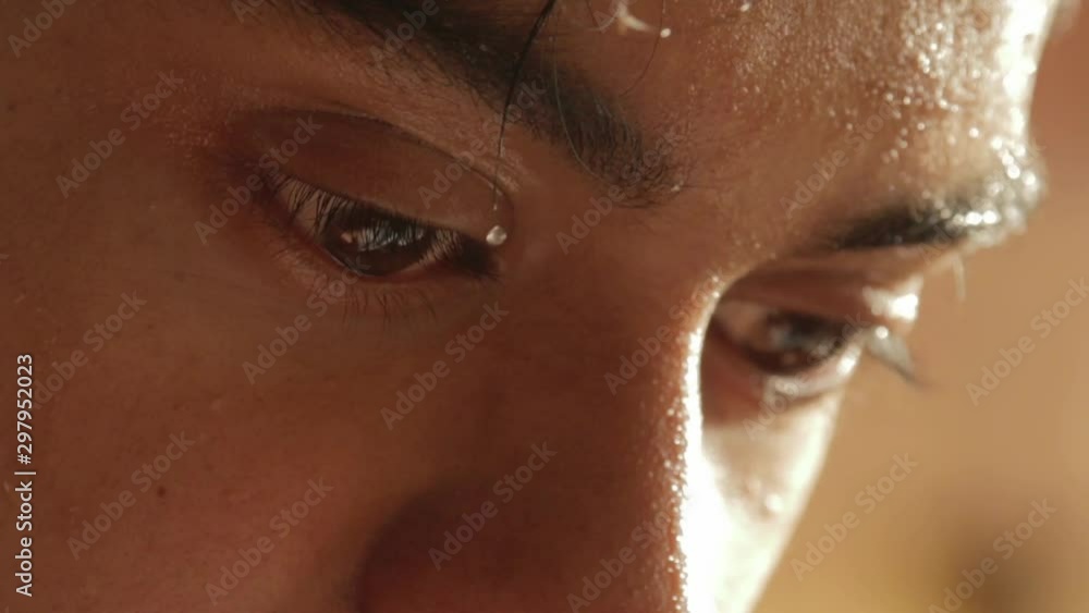 Closeup of sweating teenage boy intensely working by writing and doing ...