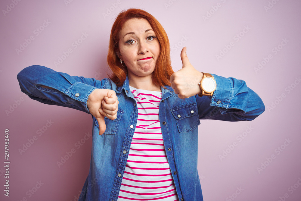 Beautiful redhead woman wearing denim shirt and striped t-shirt over ...