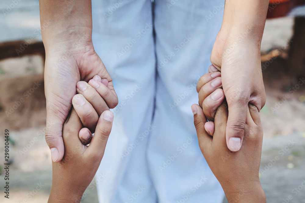Mother helping holding hands son is Teamwork family relationship rescue ...