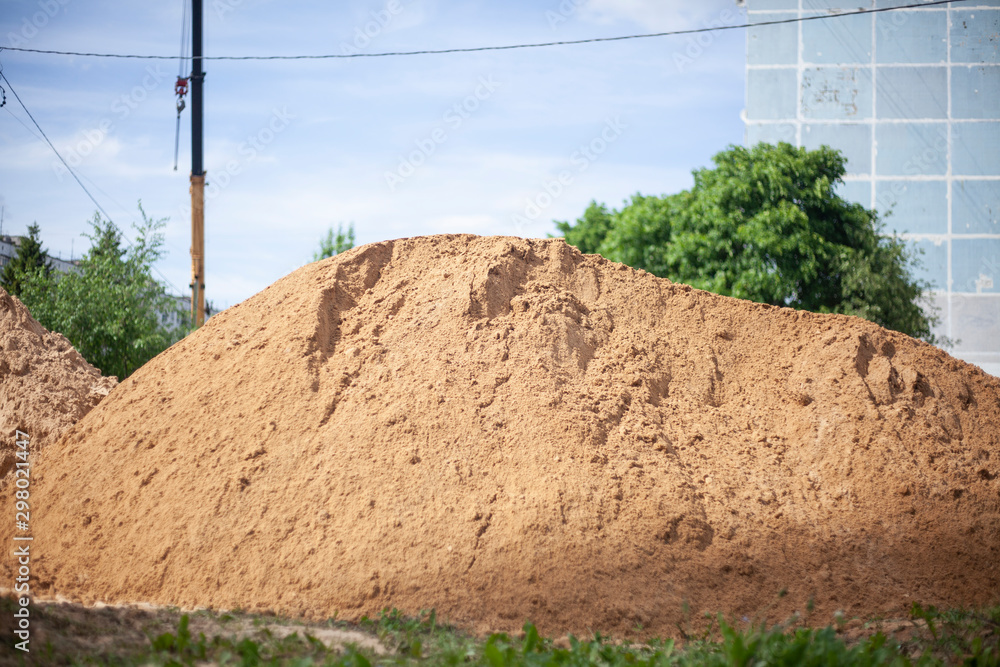 Mountain of sand. Building materials at a construction site. Site ...