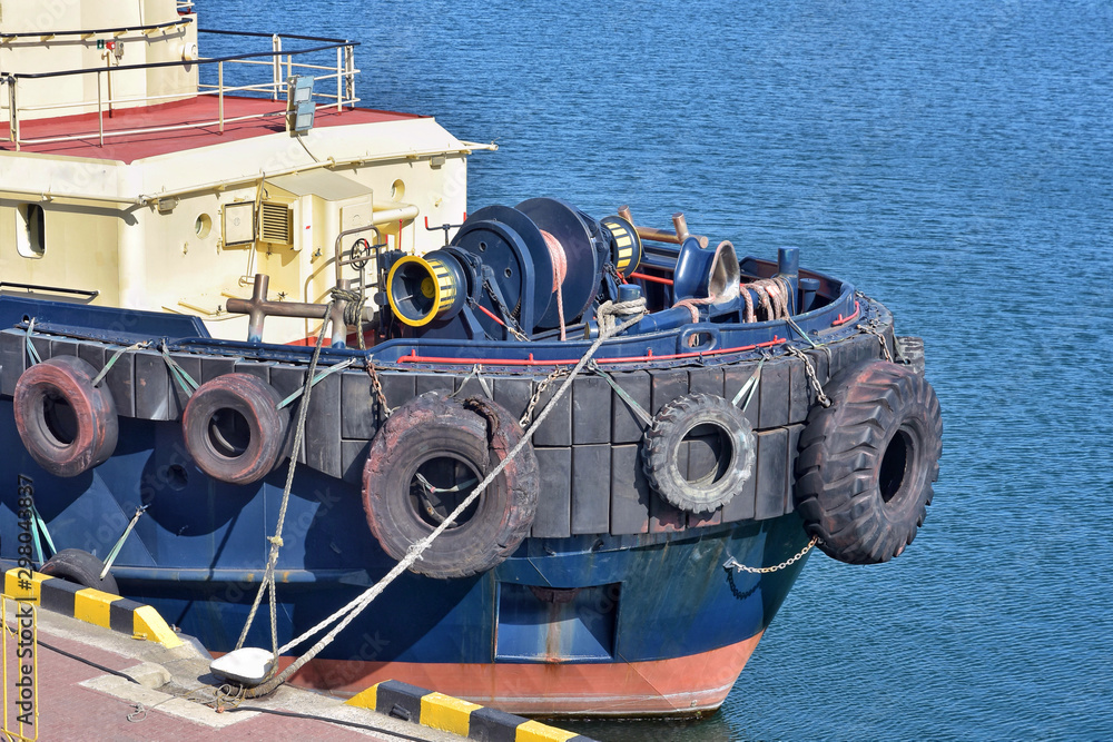 Tug ship bow with large rubber wheels. big tires of the deck of a tug ...