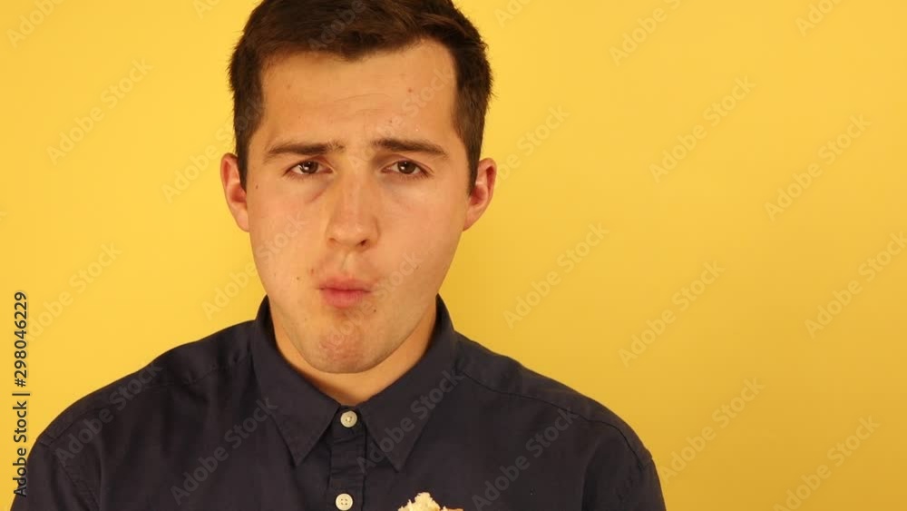 people casually chewing on food on an orange background Stock-Video ...