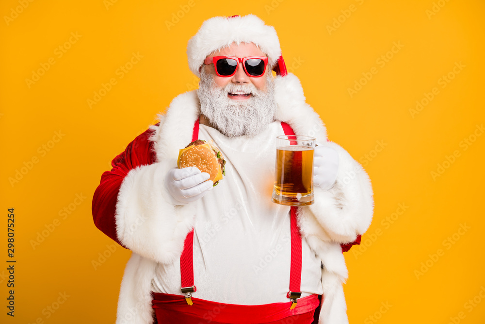 Foto de Portrait of funny funky santa claus with big belly want relax ...