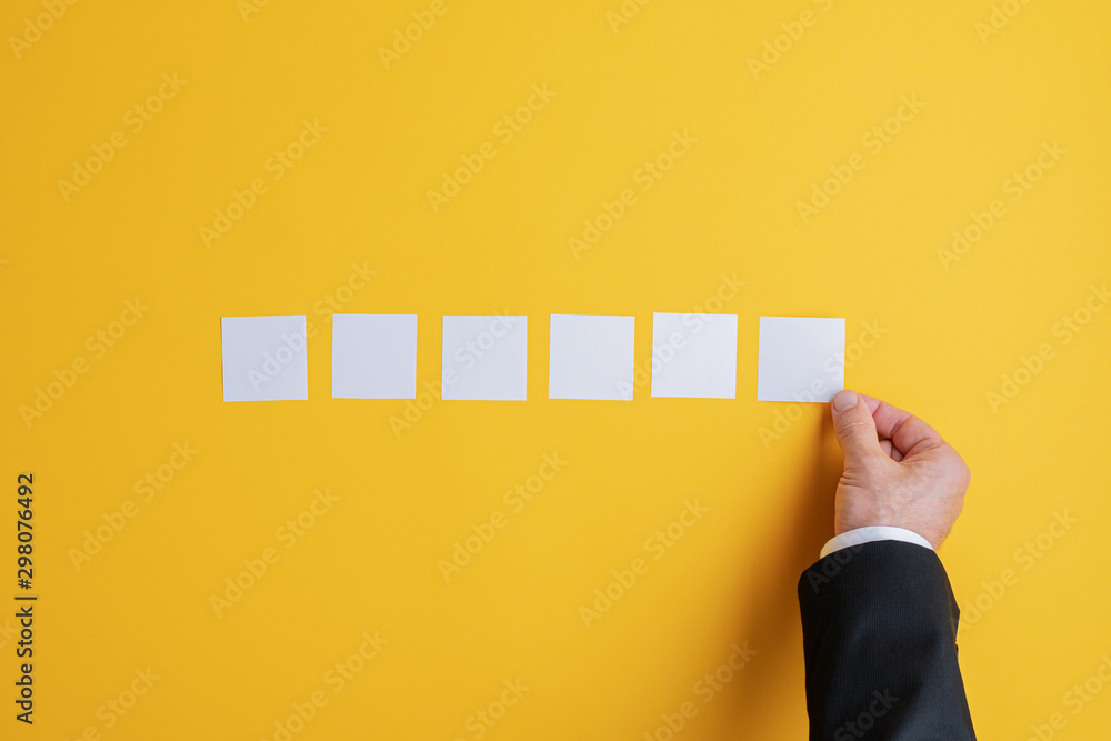 Placing six blank post it papers in a row Stock Photo | Adobe Stock
