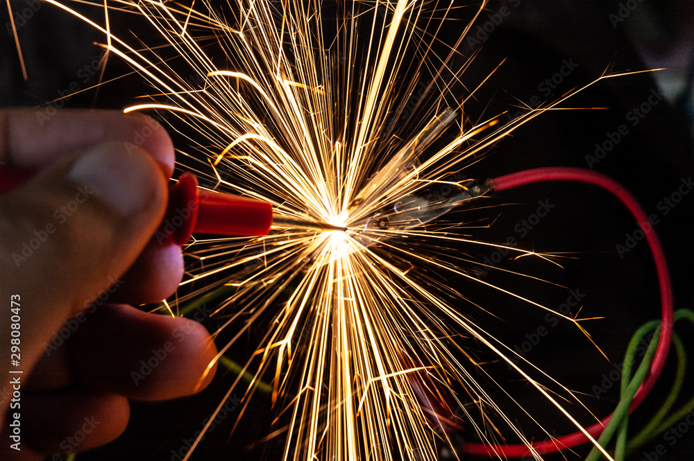 Bright burning sparks fly from the electric short contact Stock Photo ...