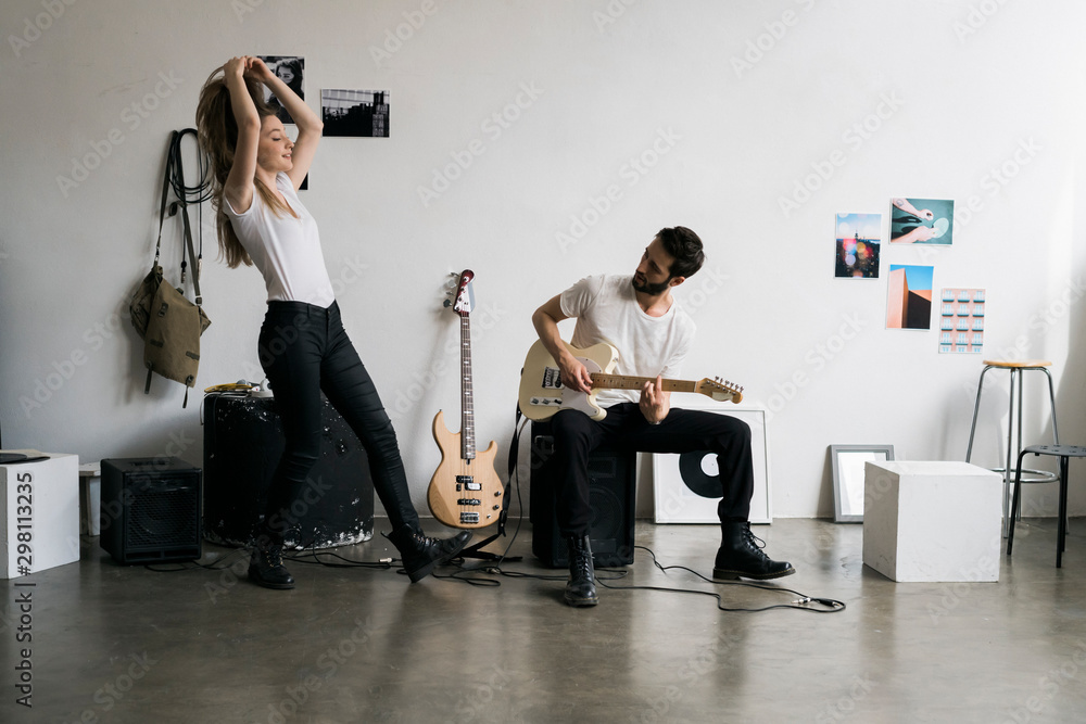 Young couple playing together in the recording studio Stock Photo ...