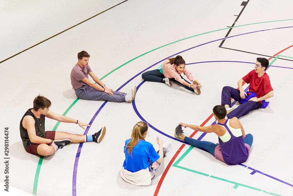 Teenage students making exercise Stock Photo | Adobe Stock