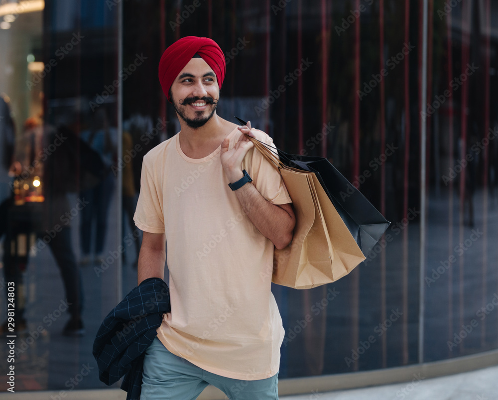 Handsome Indian Man Enjoying Shopping Stock Photo | Adobe Stock