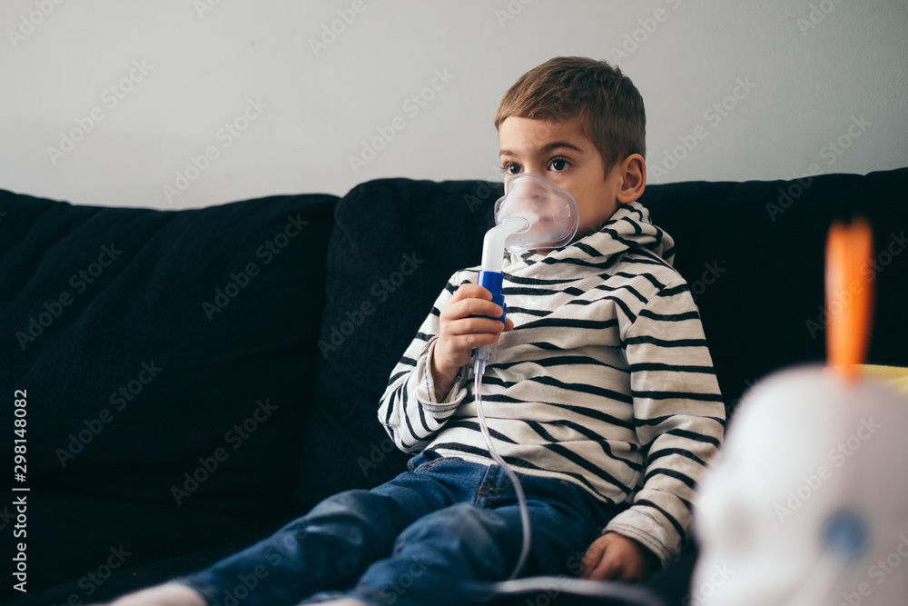 Kid holding inhaler Stock Photo | Adobe Stock