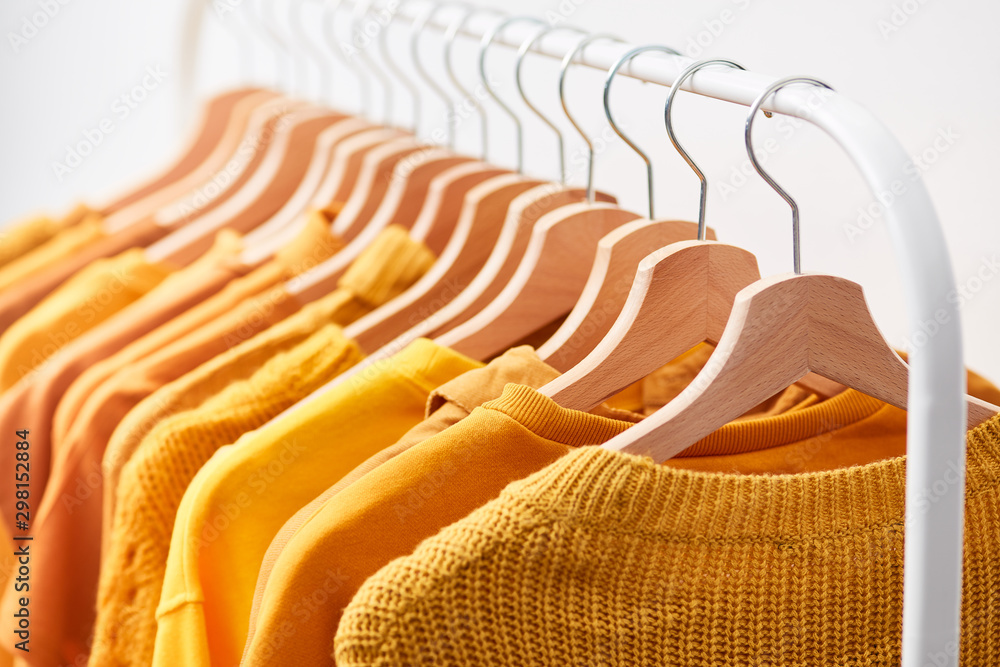 Bright yellow clothes on rack Stock Photo | Adobe Stock
