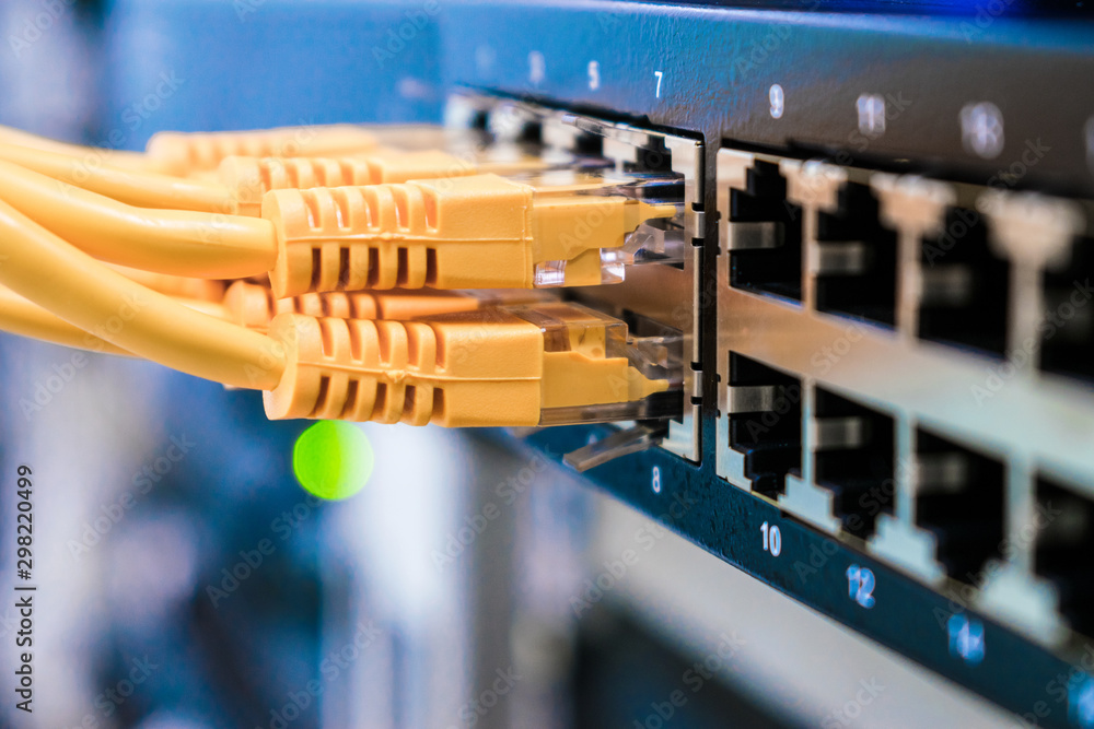 Several yellow network wires connect to switching hub interfaces. Utp ...