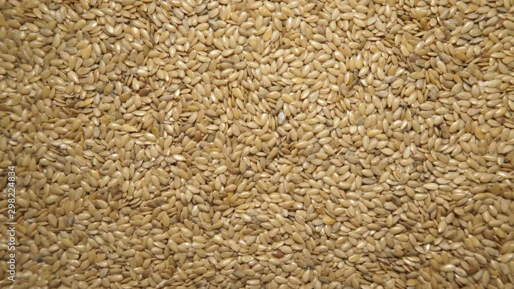 Golden raw flax seeds linseed as natural food background or grain ...
