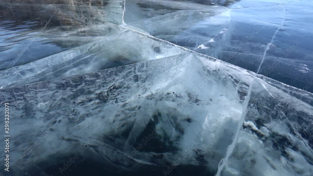 Blue clear transparent ice iceberg details. Cinematic deep crack unique ...