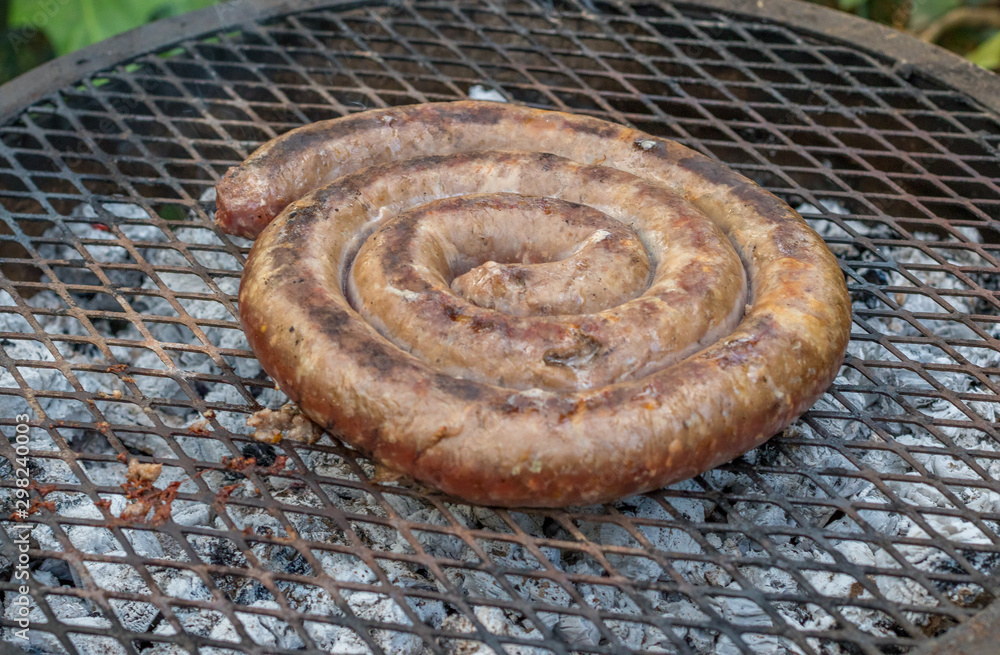 Boerewors sausage is a traditional South African dish cooked outdoors ...