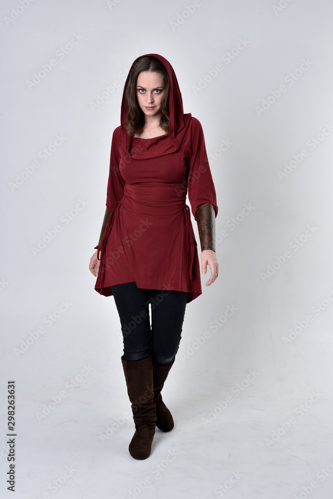 full length portrait of a brunette girl wearing a red fantasy tunic ...