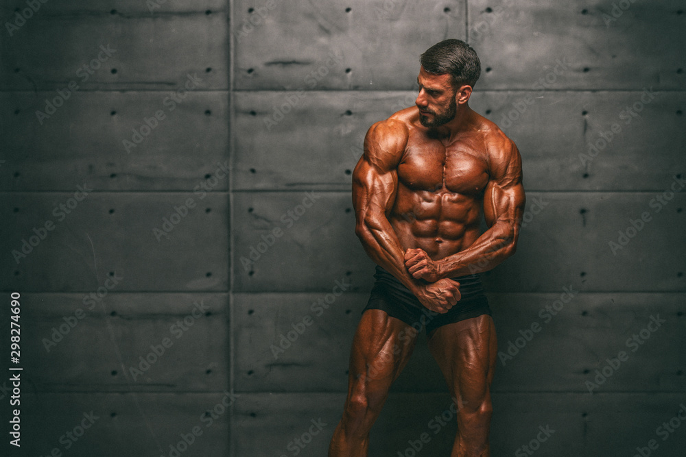 Handsome, Very Muscular Men Flexing Muscles. Bodybuilder Posing and ...