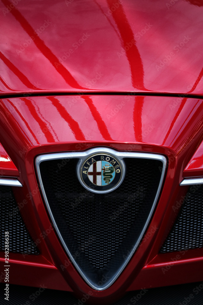 Alfa Romeo shield on the red car, italian design Stock Photo | Adobe Stock