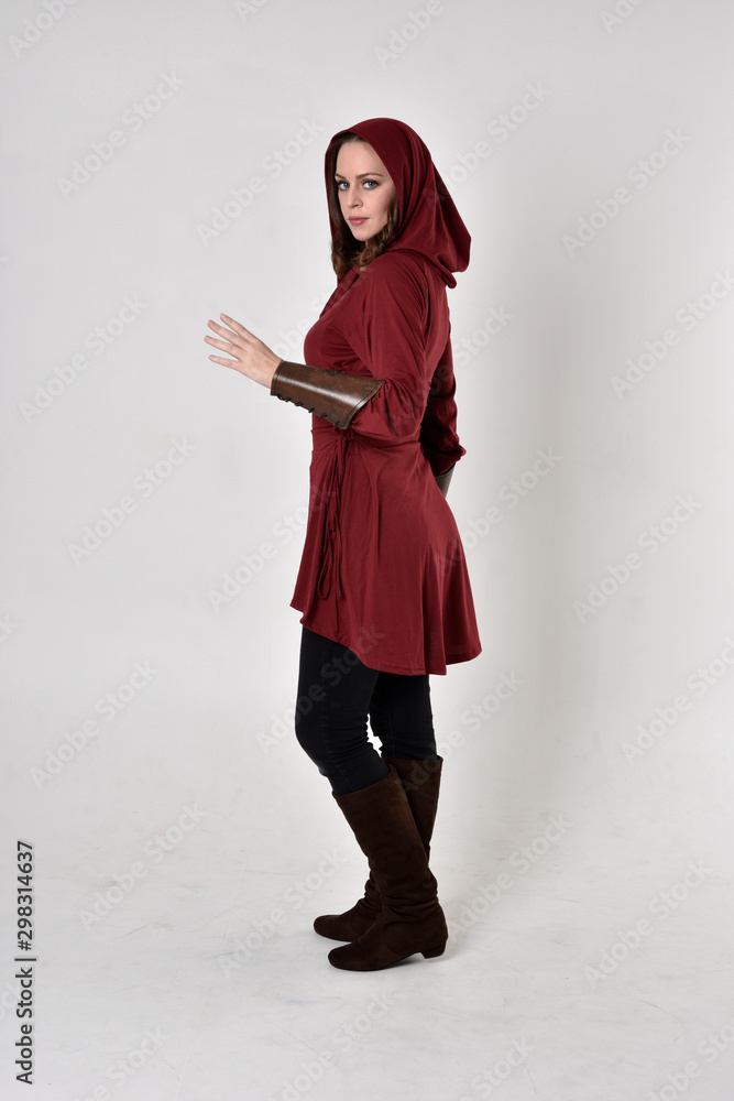 full length portrait of a brunette girl wearing a red fantasy tunic ...