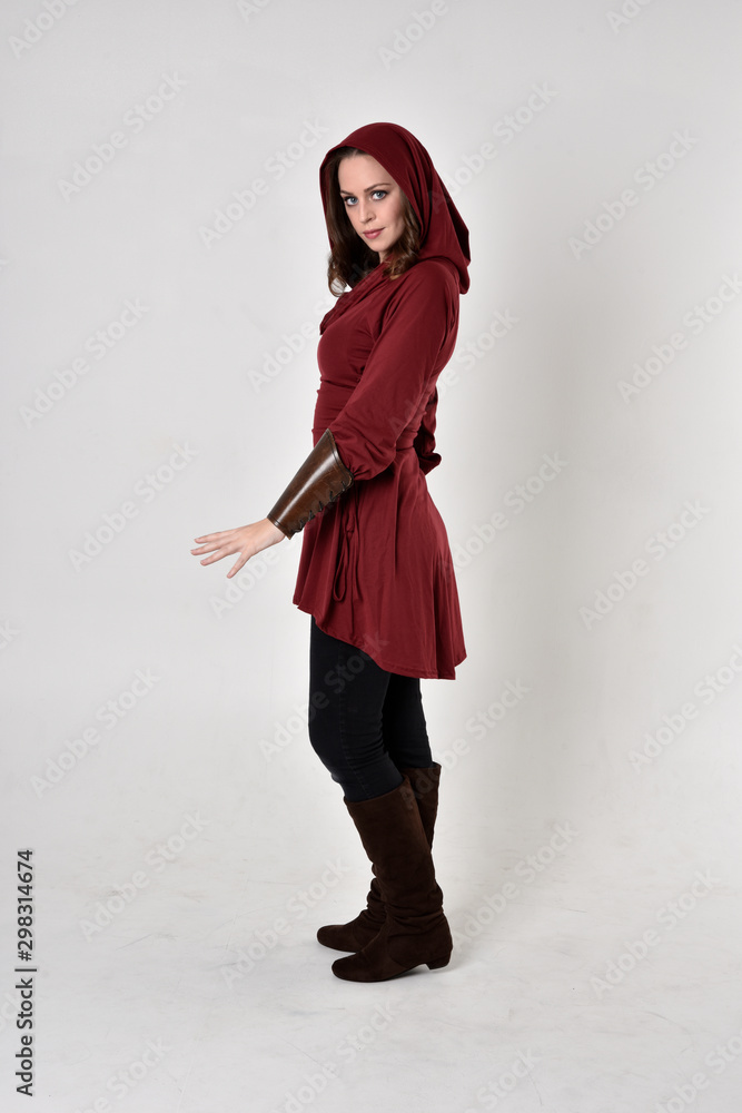 full length portrait of a brunette girl wearing a red fantasy tunic ...
