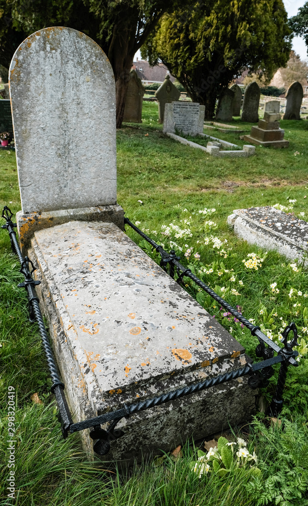 Very old stone gravestone with tomb seen in a summer cemetery. Stock ...