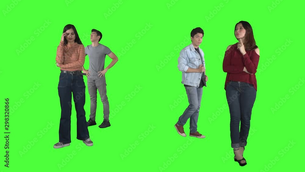 Group of confused young people thinking something while walking back and forth in the studio ...