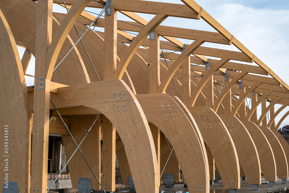 Detail of a modern wooden architecture in glued laminated timber on a ...