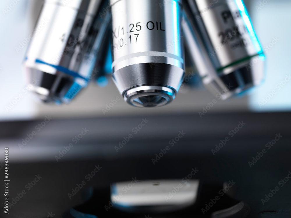 Microscope being used to view a sample in the lab Stock Photo | Adobe Stock