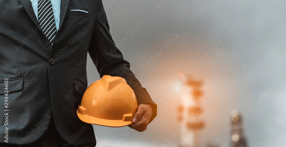 Close-up the male engineer is carrying a safety hat thinking of ways ...