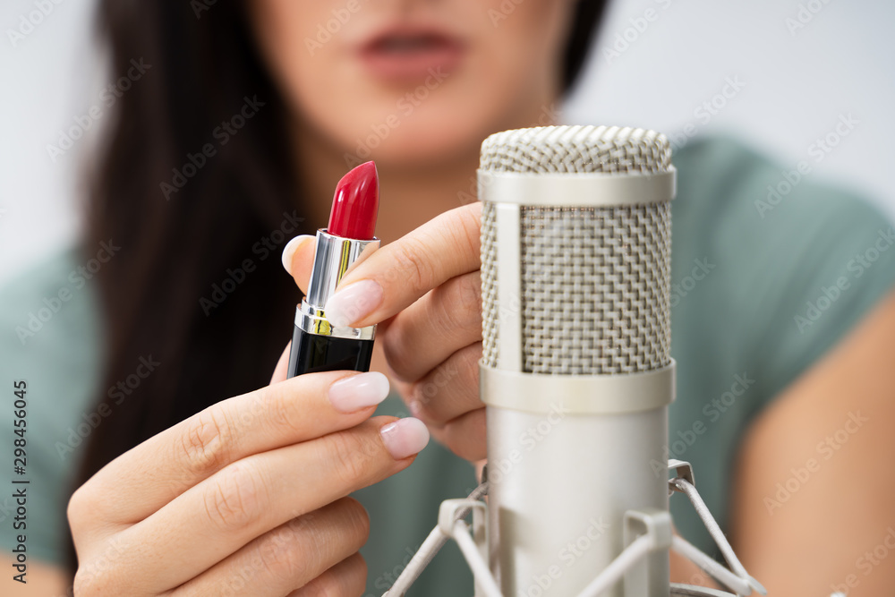 Woman Using Lipstick On Microphone To Make Asmr Sounds Stock Photo ...