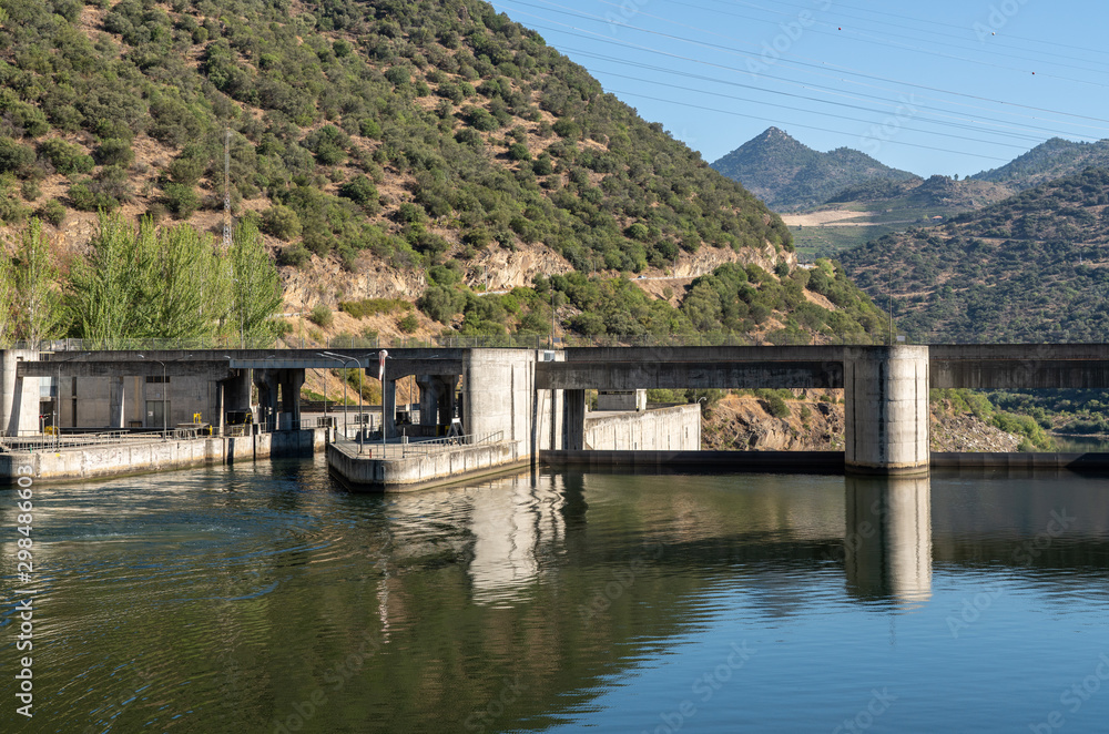 Solid structure of the Valeira dam on River Dourowith lock and gates on ...