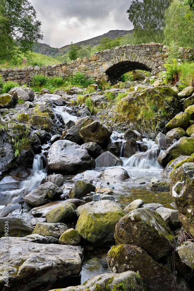 Waterfalls on the Barrow Beck river at historic stone packhorse bridge ...