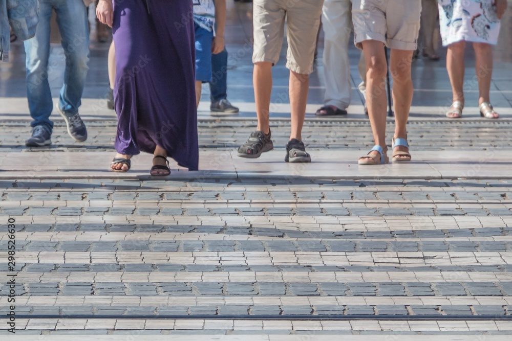 Pedestrian crossing downtown city crowd walk in motion on road. Many ...