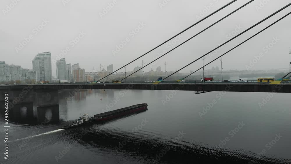 Concrete major bridge with steel cables in industrial smog at downtown ...