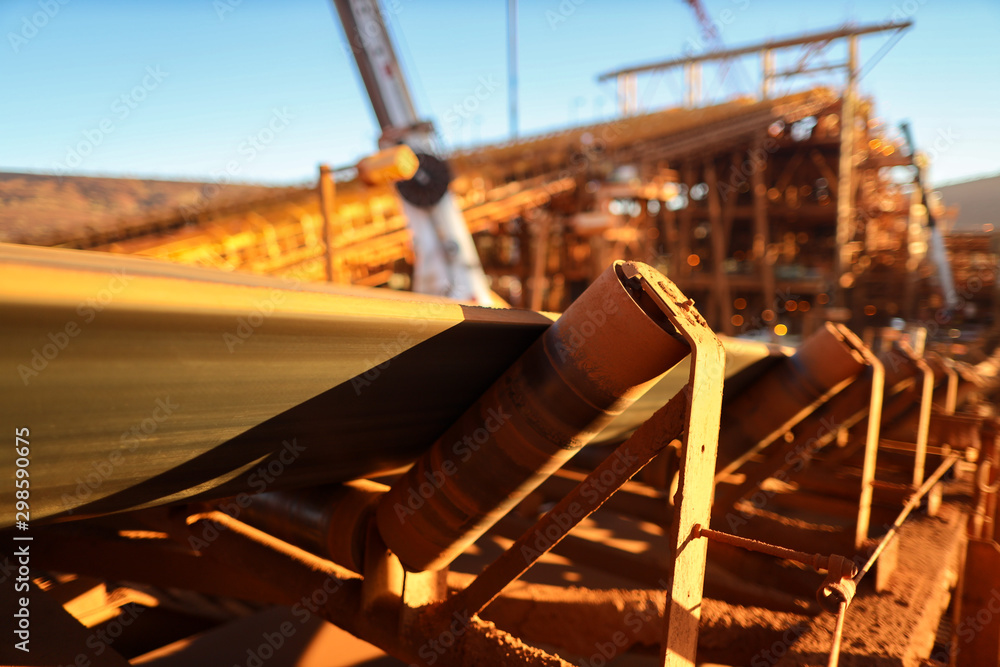 Conveyor belt and rollers structures line its transfer iron ore into ...