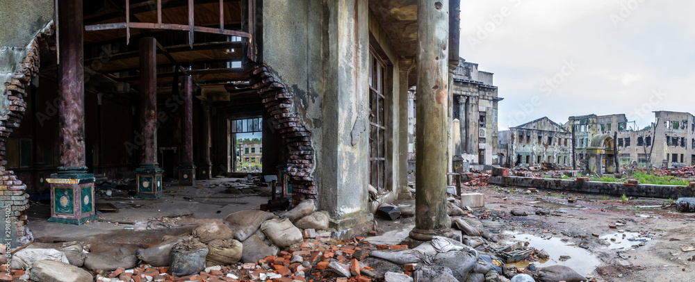 The destroyed buildings. Abandoned city. The streets of the ruined city ...