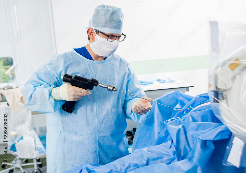 Arthroscope surgery. Orthopedic surgeons in teamwork in the operating ...