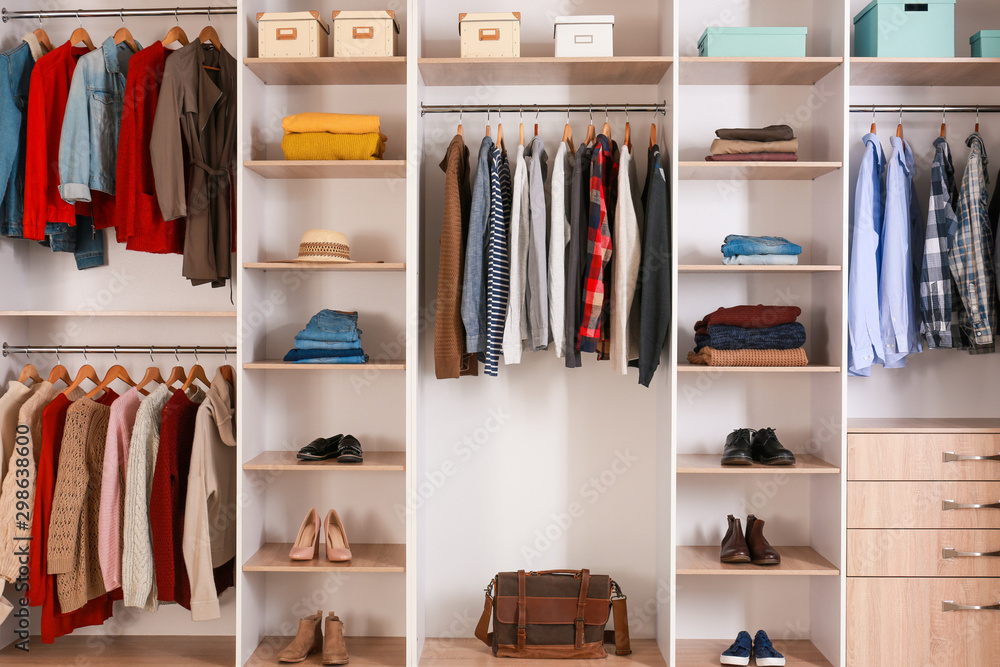 Big wardrobe with clothes in dressing room Stock Photo | Adobe Stock