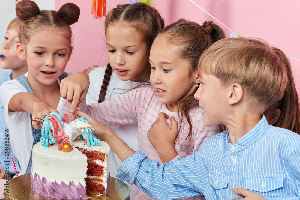 little cute children eating cake with fingers. close up photo. isolated ...
